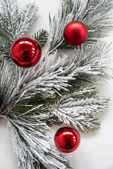 Flocked mixed pine with red ball spray - Greenery Market
